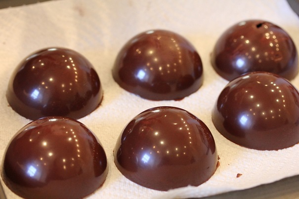 Chocolate Spheres filled with Chocolate Mousse, with Praline Sauce and ...